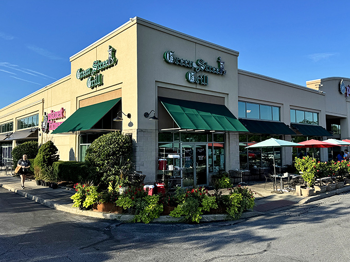 Green awnings and flower boxes create the perfect "come on in" vibe that makes strangers feel like regulars.