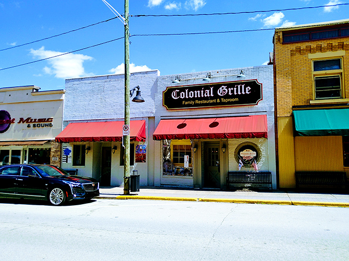 The classic brick fa&ccedil;ade and red awnings of Colonial Grille stand as a beacon of breakfast hope on Irwin's Main Street, promising comfort food salvation to hungry travelers.