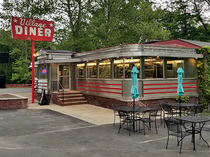 The classic stainless steel exterior with red trim announces you've arrived somewhere special&mdash;a genuine slice of Americana waiting in Milford.