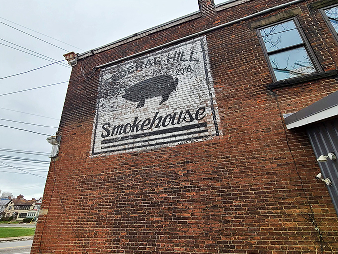 The writing's on the wall&mdash;literally! Federal Hill Smokehouse's rustic brick exterior proudly displays its mission with a simple pig silhouette that promises smoky delights within.