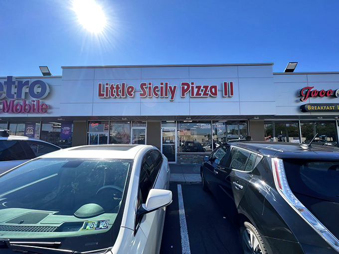 The bright red sign of Little Sicily Pizza 2 beckons like a lighthouse for the hungry. Philadelphia's culinary odd couple &ndash; Italian tradition meets Indian spice &ndash; hiding in plain sight.