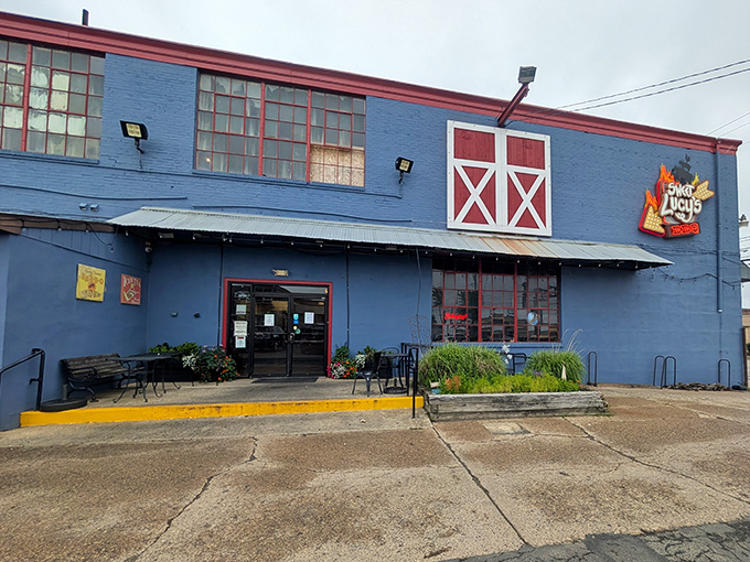 The blue barn-like exterior with its distinctive red trim isn't just eye-catching&mdash;it's a smoke signal to BBQ lovers that authentic goodness awaits inside.