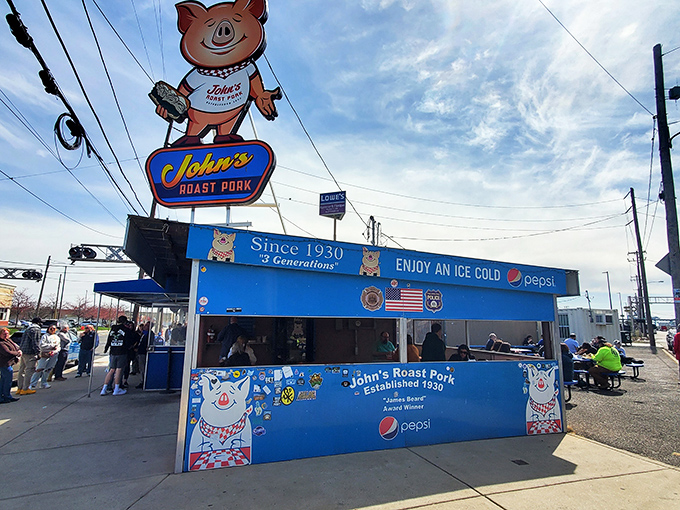 The bright blue exterior of John's Roast Pork stands out like a culinary lighthouse, guiding hungry souls to sandwich nirvana since 1930.