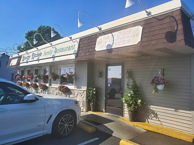 The unassuming exterior of Kountry Kitchen belies the culinary treasures within. Those hanging flower baskets aren't just for show&mdash;they're your first clue this place cares about the details.