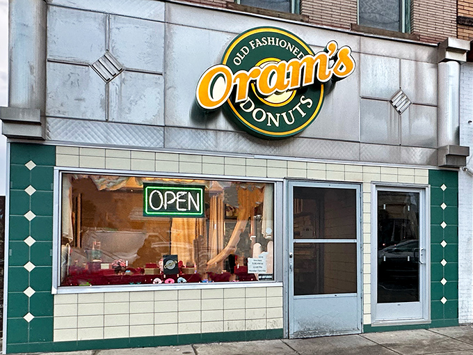 The classic storefront of Oram's Donut Shop stands proudly in Beaver Falls, a beacon of sweet hope for early risers and donut enthusiasts alike.
