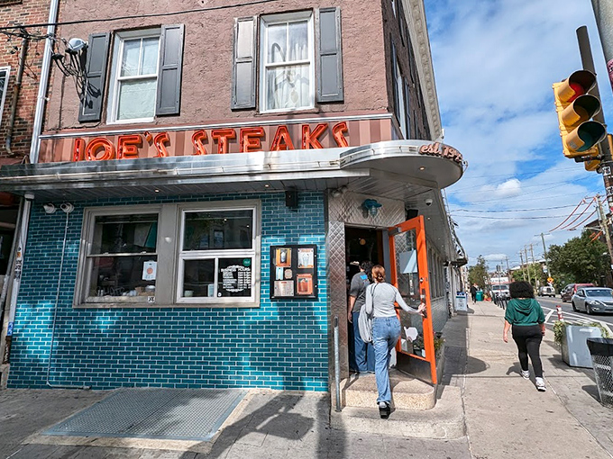 That iconic neon sign and turquoise tile exterior isn't just eye-catching&mdash;it's a time machine disguised as a corner shop in Philadelphia.