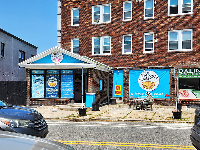 That cheerful blue storefront practically winks at you from the sidewalk, promising pierogi paradise within.