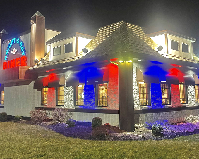 The iconic blue Knight & Day Diner sign promises comfort and satisfaction, standing like a beacon for hungry travelers on Pennsylvania's backroads.