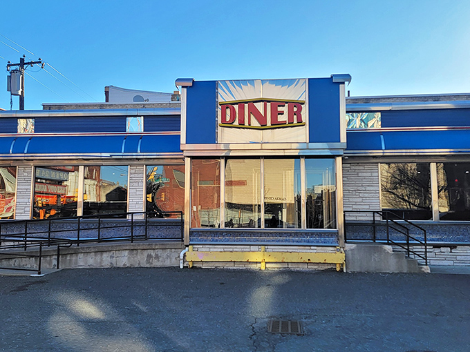 The iconic blue and silver facade of Broad Street Diner stands like a time capsule of Americana, beckoning hungry travelers with its classic neon promise.