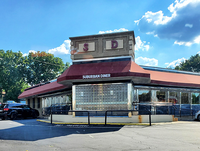 The iconic Suburban Diner sign stands proud along Bustleton Pike, promising "BAKING ON PREMISES" &ndash; a siren song for carb enthusiasts everywhere.