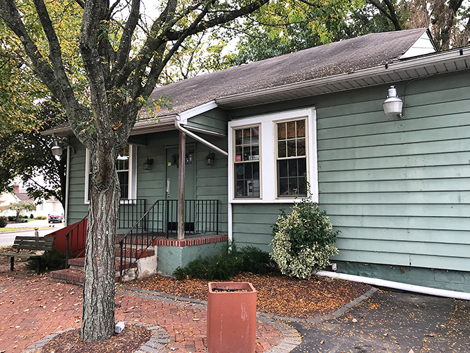 The unassuming exterior of The Pines Tavern proves once again that culinary treasures often hide in plain sight, nestled under mature trees on a quiet Bristol street.