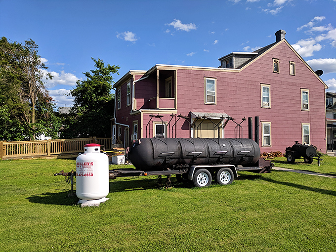 The burgundy-colored house doesn't scream "barbecue destination" until that first whiff of smoke hits your nose. Culinary magic happens in unexpected places.