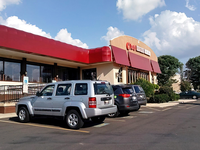 The iconic red awning of Club House Diner stands like a beacon of comfort food hope in Bensalem, promising turkey dinners worth the drive from anywhere in Pennsylvania.