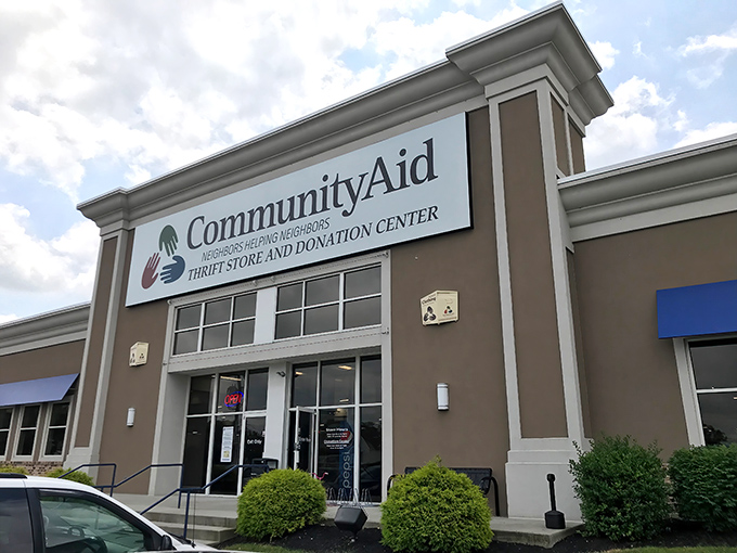 The welcoming storefront of CommunityAid stands ready for treasure hunters, where retail therapy meets community impact under the bright Pennsylvania sky.
