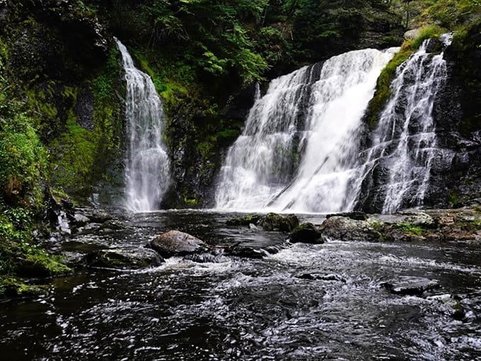 Nature's three-tiered masterpiece puts on a spectacular show, with rushing water carving through ancient rock formations in Pennsylvania's hidden gem.