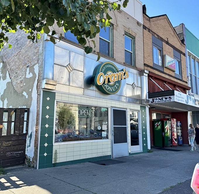 The iconic green and gold sign of Oram's beckons like a lighthouse for the sugar-deprived. This unassuming storefront has launched a thousand diet cheat days since 1938.