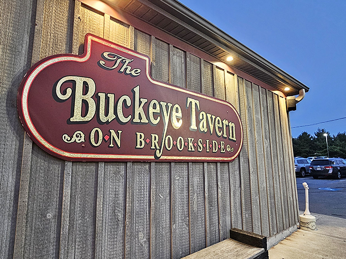 The stone facade of Buckeye Tavern stands proudly along the roadside, its dormer windows and rustic charm beckoning hungry travelers like a culinary lighthouse.