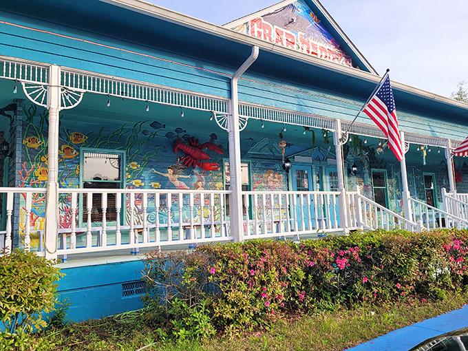 The teal-blue exterior of Crab Daddy's beckons like a siren call to seafood lovers. That glowing "OPEN" sign might as well say "PARADISE FOUND."