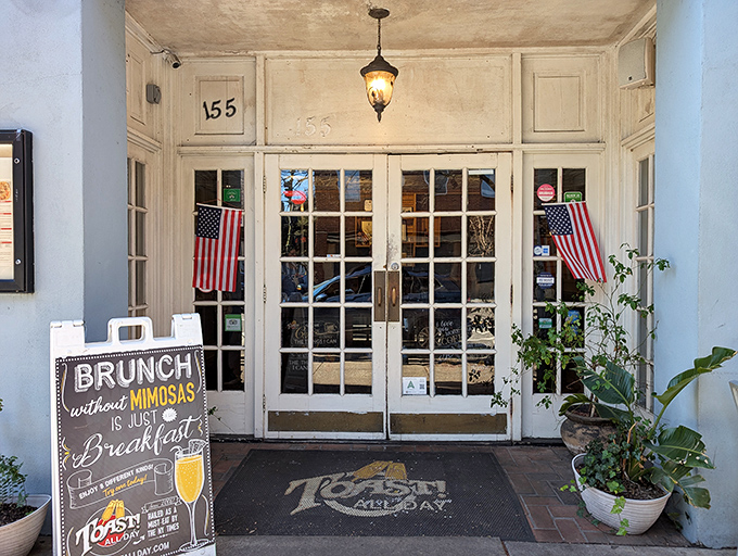 Those green awnings whisper promises of breakfast bliss hiding behind Charleston's most unassuming storefront.