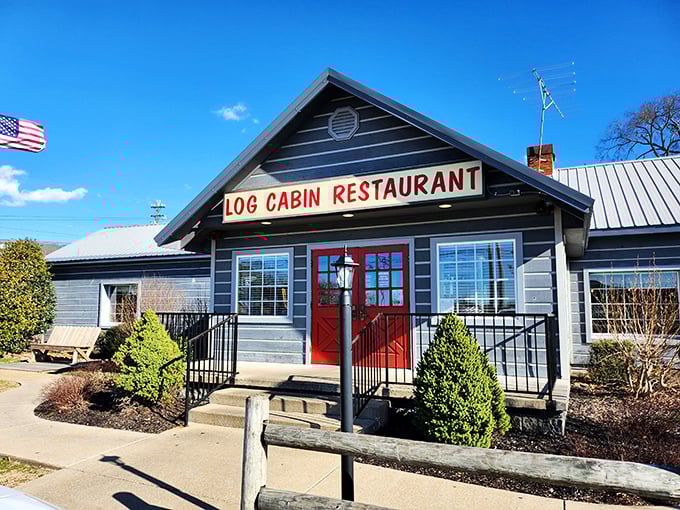 The iconic blue exterior with those cherry-red doors isn't just inviting—it's practically Tennessee's way of saying "get in here and eat something amazing."