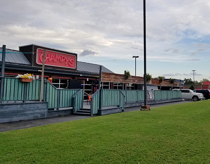 The glowing red Champy's sign beckons hungry travelers like a Southern food lighthouse guiding ships to delicious shores.