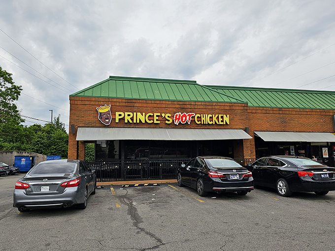 The unassuming brick exterior with its vibrant sign is Nashville's equivalent of a culinary warning label: "Proceed with taste buds at your own risk!"