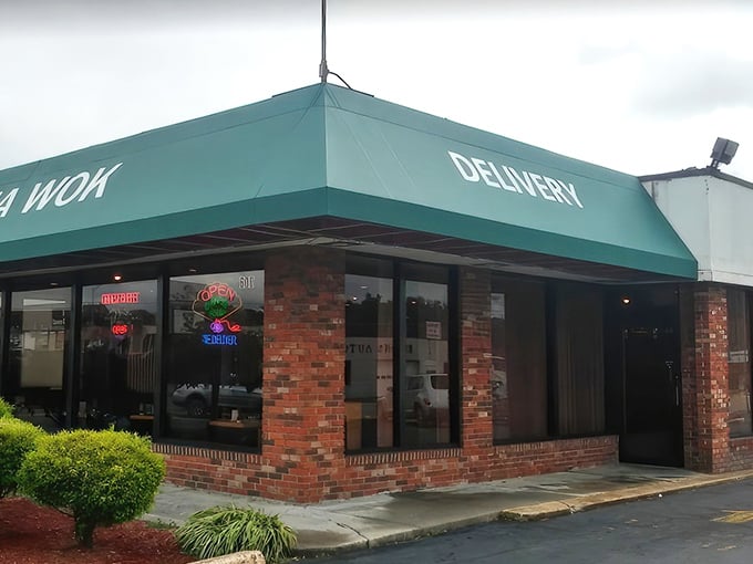 The modest green awning and brick facade hide culinary treasures within, like finding a diamond in your fortune cookie.