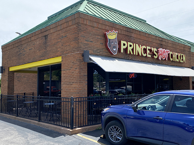 The unassuming brick exterior of Prince's Hot Chicken South belies the flavor inferno waiting inside. That green roof? Nature's warning sign.