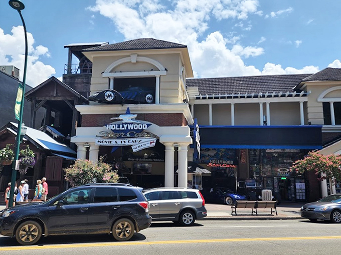 The Hollywood Star Cars Museum stands proudly on Gatlinburg's bustling Parkway, beckoning movie buffs and gearheads alike with its iconic signage and promise of automotive stardom.