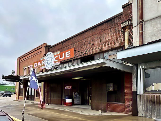 The unassuming brick exterior of Louie Mueller Barbecue &ndash; where culinary pilgrimages begin and diets go to die gloriously.
