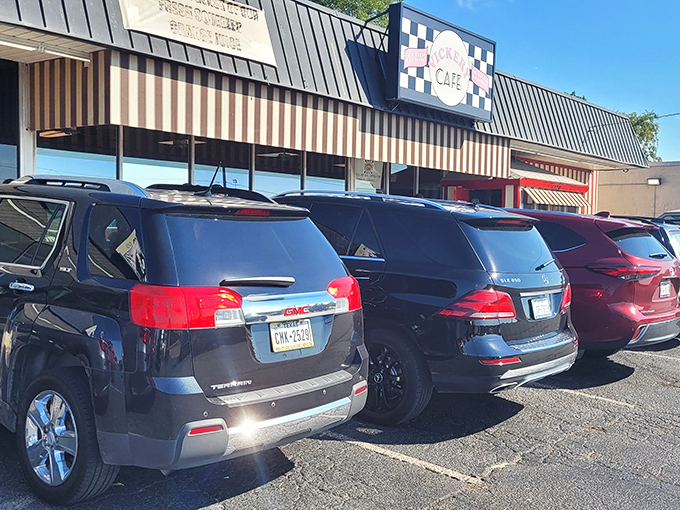 The unassuming exterior of Vickery Cafe might not stop traffic, but the full parking lot tells the real story. Culinary treasures often hide in plain sight.