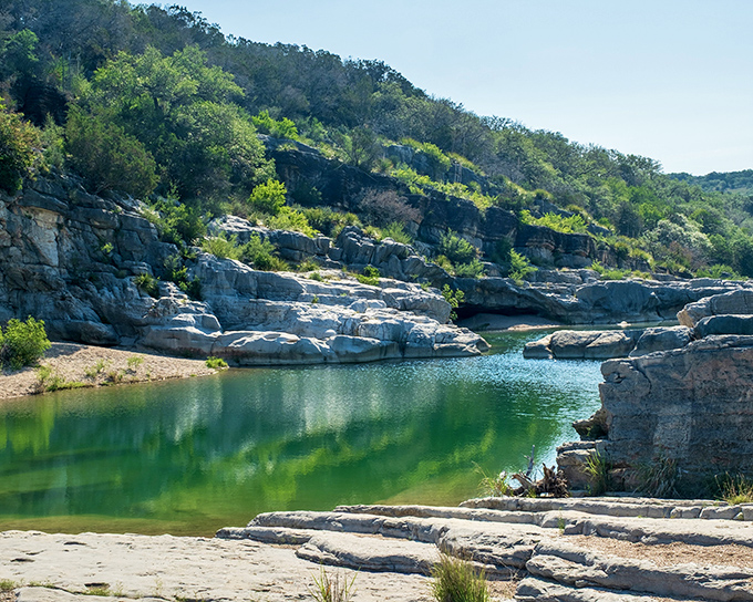 Nature's own infinity pool. The emerald waters of Pedernales Falls create a stunning contrast against ancient limestone that's been perfecting its pose for millions of years.
