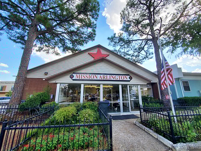 The iconic red star atop Mission Arlington welcomes bargain hunters like a North Star for thrift enthusiasts. This unassuming exterior hides a treasure trove within.