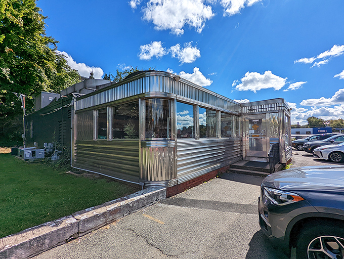 The gleaming stainless steel exterior of Frost Diner stands like a time capsule on wheels, promising comfort food and conversations that matter.