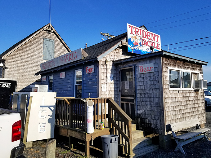 The weathered shingles and rustic charm of Trident Tackle tell stories of countless fishing adventures before memorable meals at Island House.