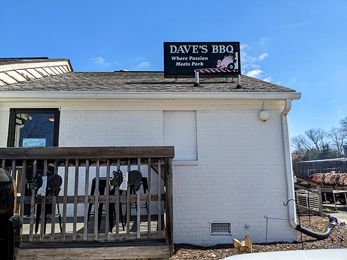 The humble white brick exterior of Dave's BBQ with its "Where Passion Meets Pork" sign serves as the gateway to Virginia's smoky paradise.