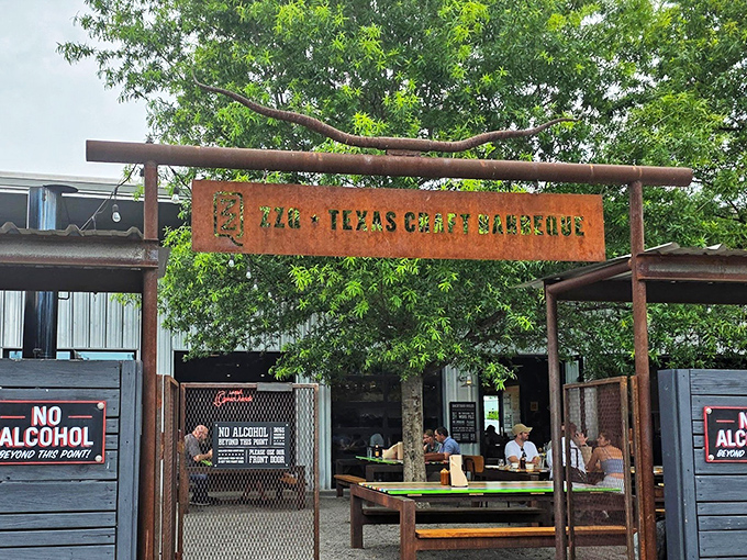 The rusted metal archway entrance to ZZQ sets the tone immediately &ndash; this isn't just dinner, it's a pilgrimage to meat paradise.