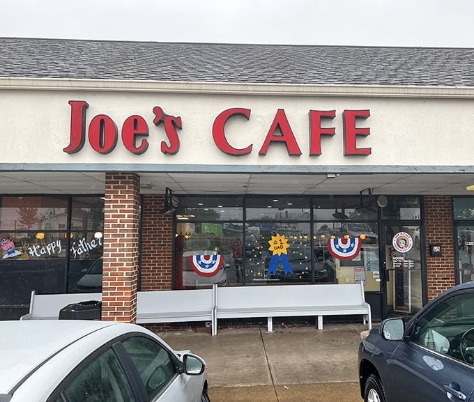 The iconic red lettering of Joe's Cafe stands as a beacon of comfort food in Sterling, where patriotic bunting and bench seating welcome hungry visitors year-round.