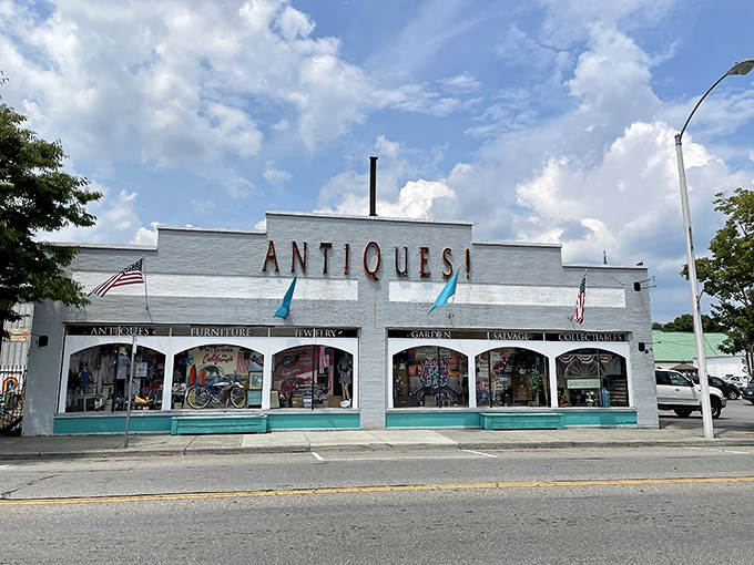 The iconic white facade of Charlotte's Web Antique Mall beckons with its bold "ANTIQUES!" declaration &ndash; like a siren song for treasure hunters everywhere.