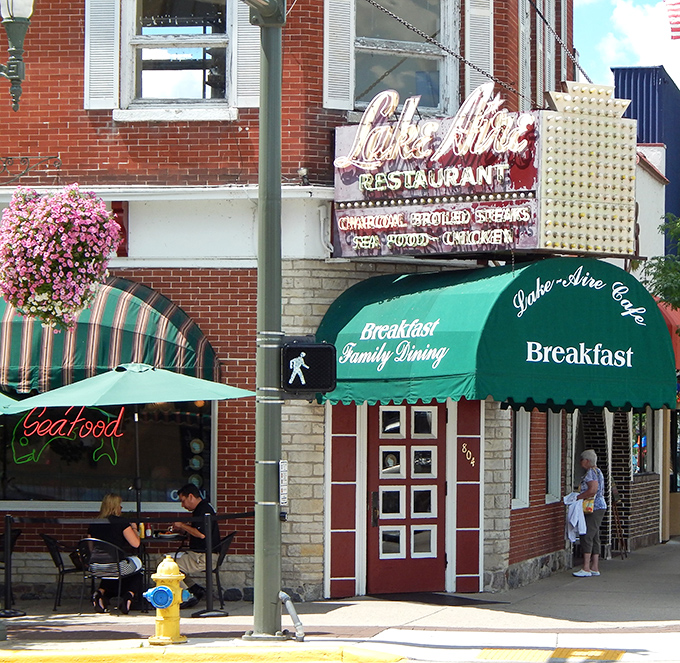 That classic brick facade and green awning whisper promises of breakfast perfection waiting inside.