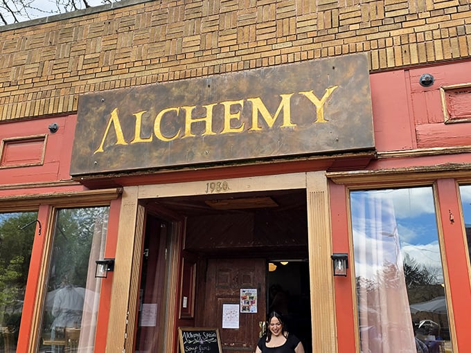 The weathered brick and golden "ALCHEMY" sign aren't just a storefront&mdash;they're a promise of culinary magic waiting inside this Madison gem.