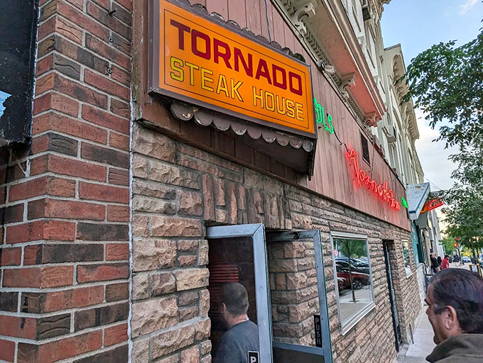The unassuming exterior of Tornado Steak House beckons like a secret handshake. This brick-faced Madison institution doesn't need flashy signage to announce its carnivorous treasures within.