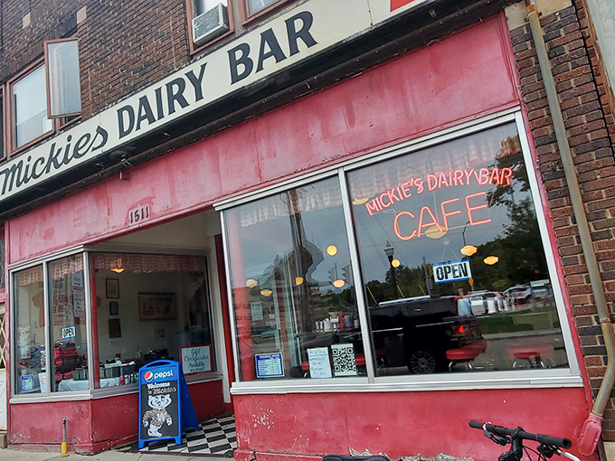 The iconic pink facade of Mickey's Dairy Bar stands as a time capsule of Americana, beckoning hungry visitors with retro charm that Instagram filters try desperately to replicate.