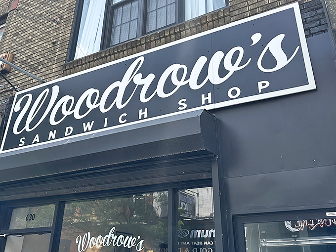 Woodrow's elegant script signage beckons sandwich pilgrims like a culinary lighthouse on Philadelphia's bustling streets. Simple, confident, irresistible.