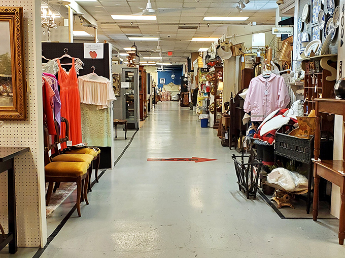 Wide aisles invite exploration through this treasure hunter's paradise, where vintage clothing and antique furniture create a time-traveler's dream landscape.