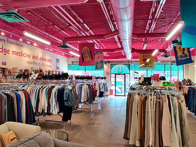The signature hot pink ceiling welcomes you like a fabulous hug. Meticulously organized racks promise treasure hunting without the usual thrift store chaos.