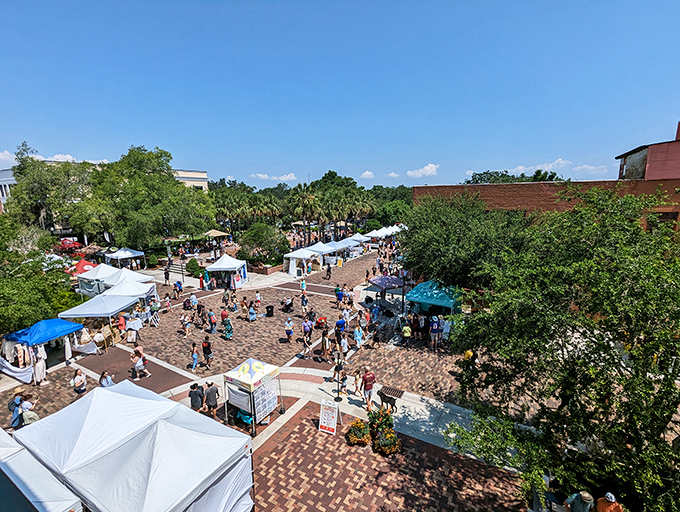 Sunshine, brick pathways, and white tents create the perfect Saturday morning backdrop where strangers become friends over fresh produce and artisanal treats.