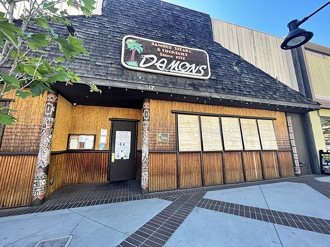 The A-frame entrance to Damon's beckons like a tiki temple in suburbia, promising tropical escape with every perfectly grilled steak.