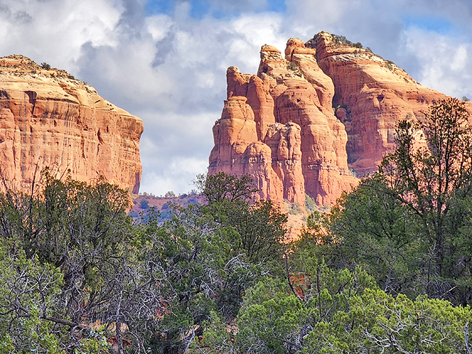 Nature's cathedral awaits at every turn in Red Rock State Park, where the sky peeks through ancient stone windows carved by time itself.