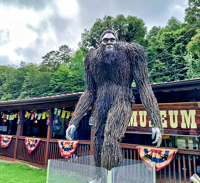 The guardian of cryptid knowledge stands tall outside EXPEDITION! Museum. Those prayer flags aren't just for show&mdash;they're Sasquatch's laundry line.